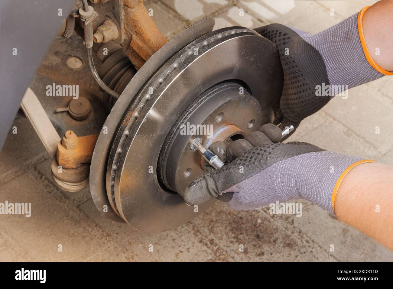 Car repair concept. Technicians are changing tires. Wheel balancing or ...