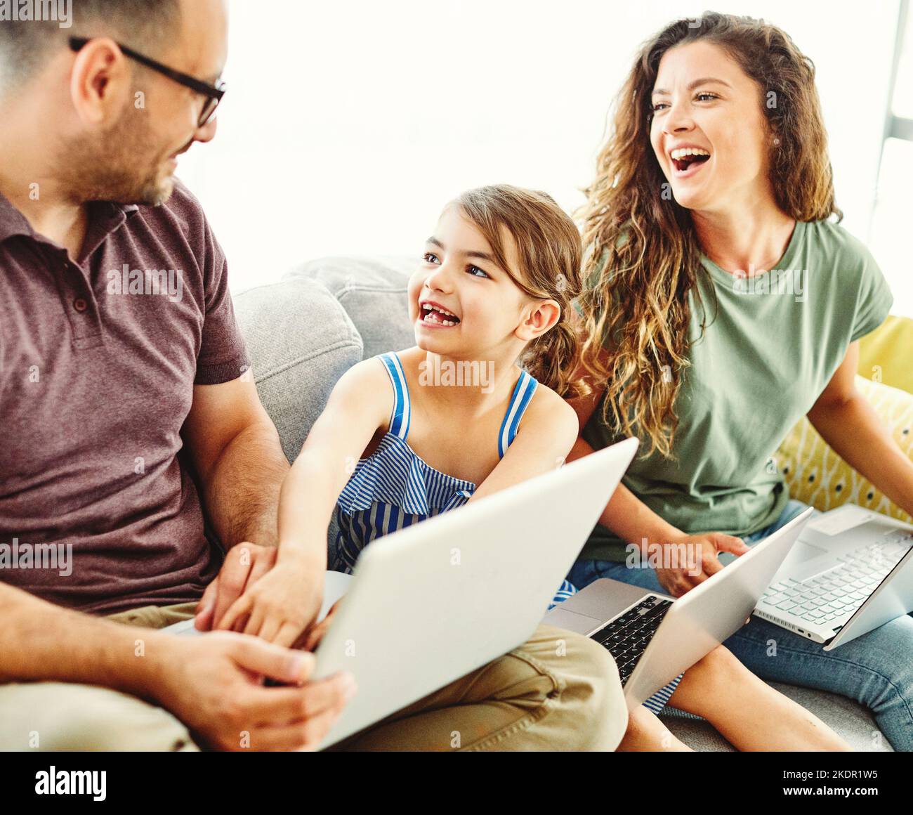 child laptop family computer woman mother father happy home man ...