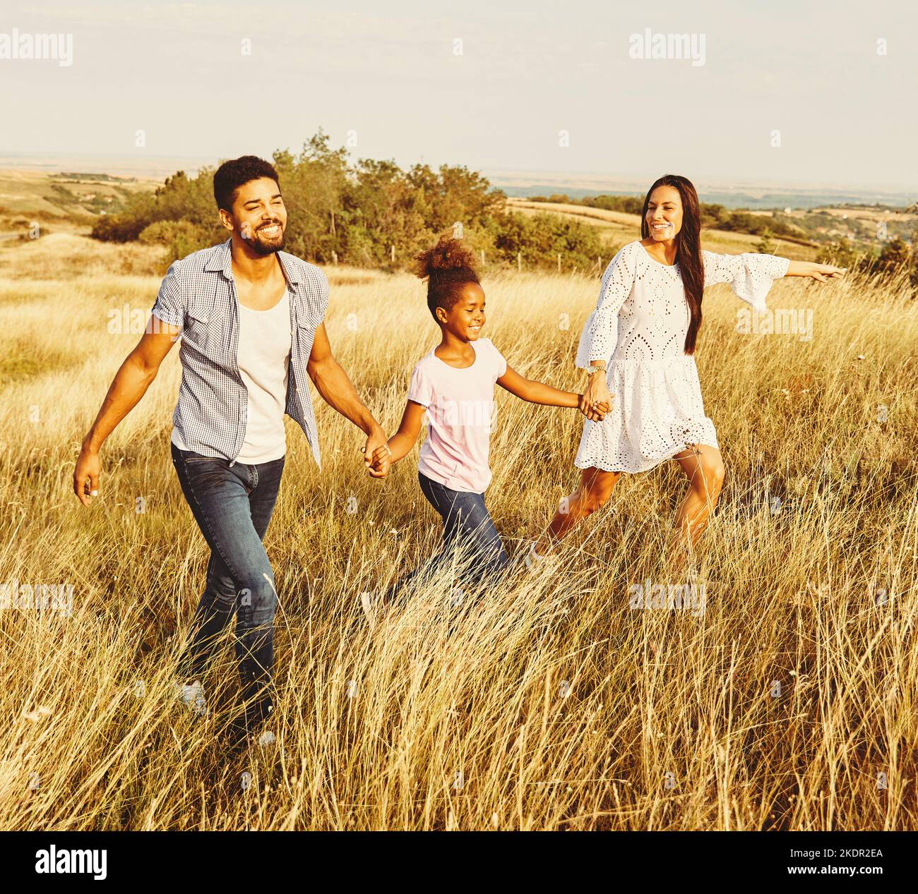 child daughter family happy mother father running active healthy ...