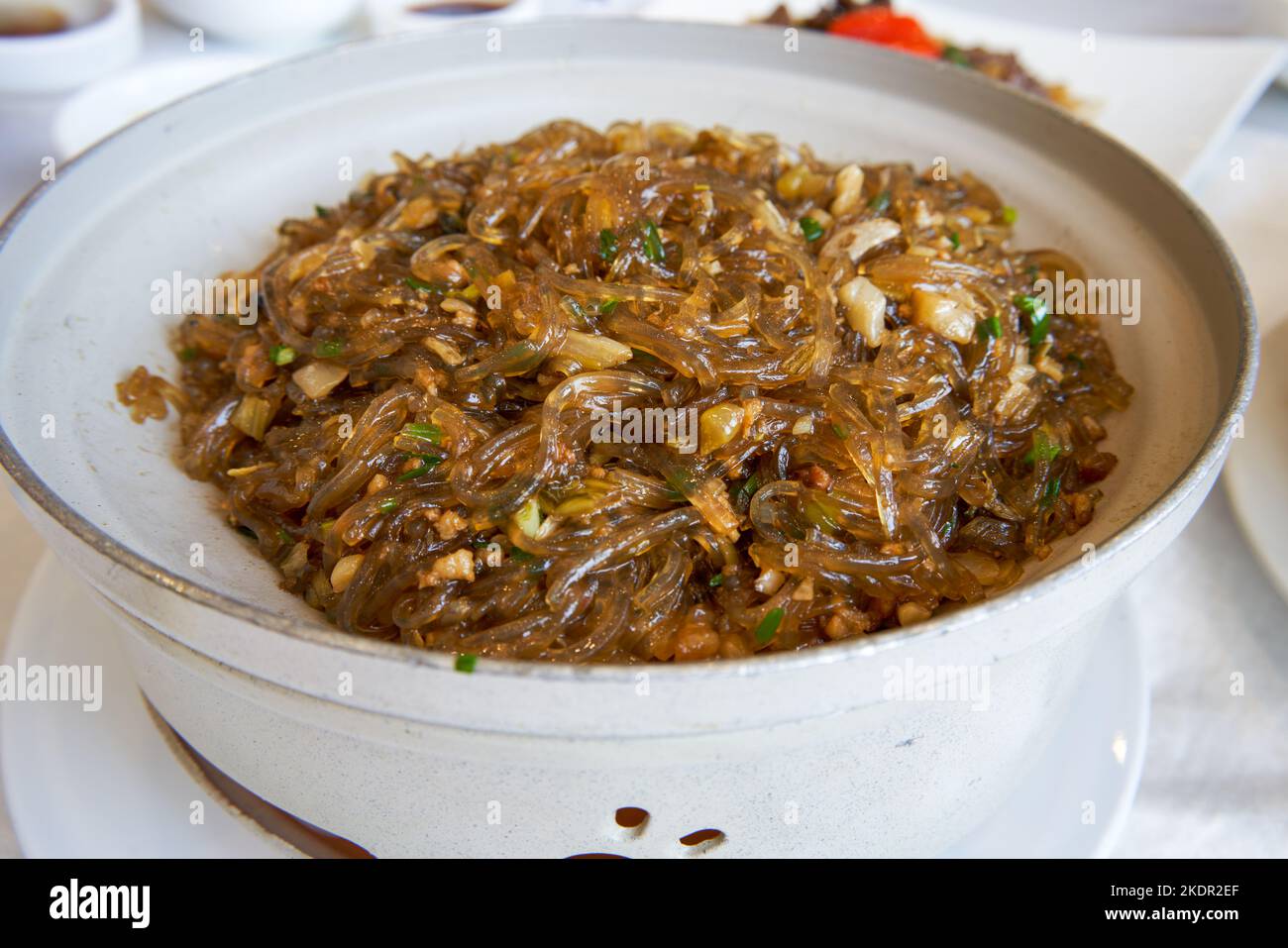 A delicious Chinese dish, fried sweet potato noodles Stock Photo - Alamy