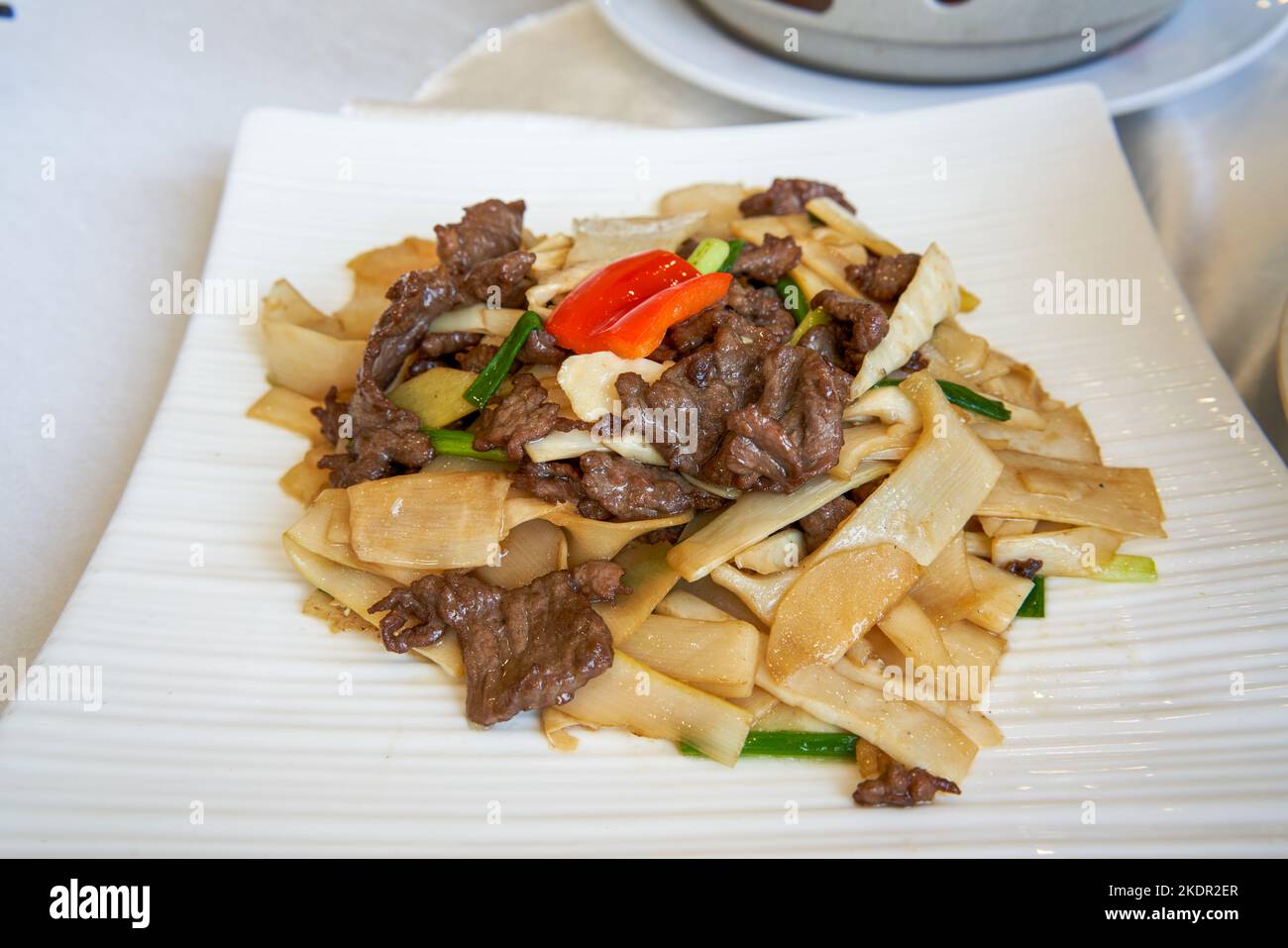 A delicious Chinese dish, fried beef with bamboo shoots Stock Photo - Alamy