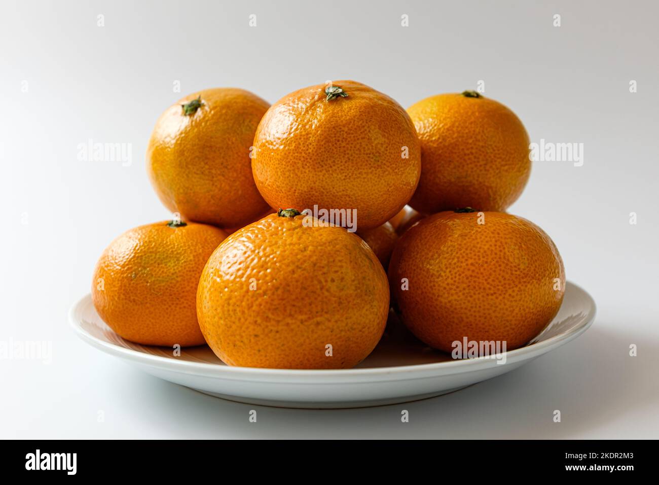 tangerines on a white background Stock Photo - Alamy