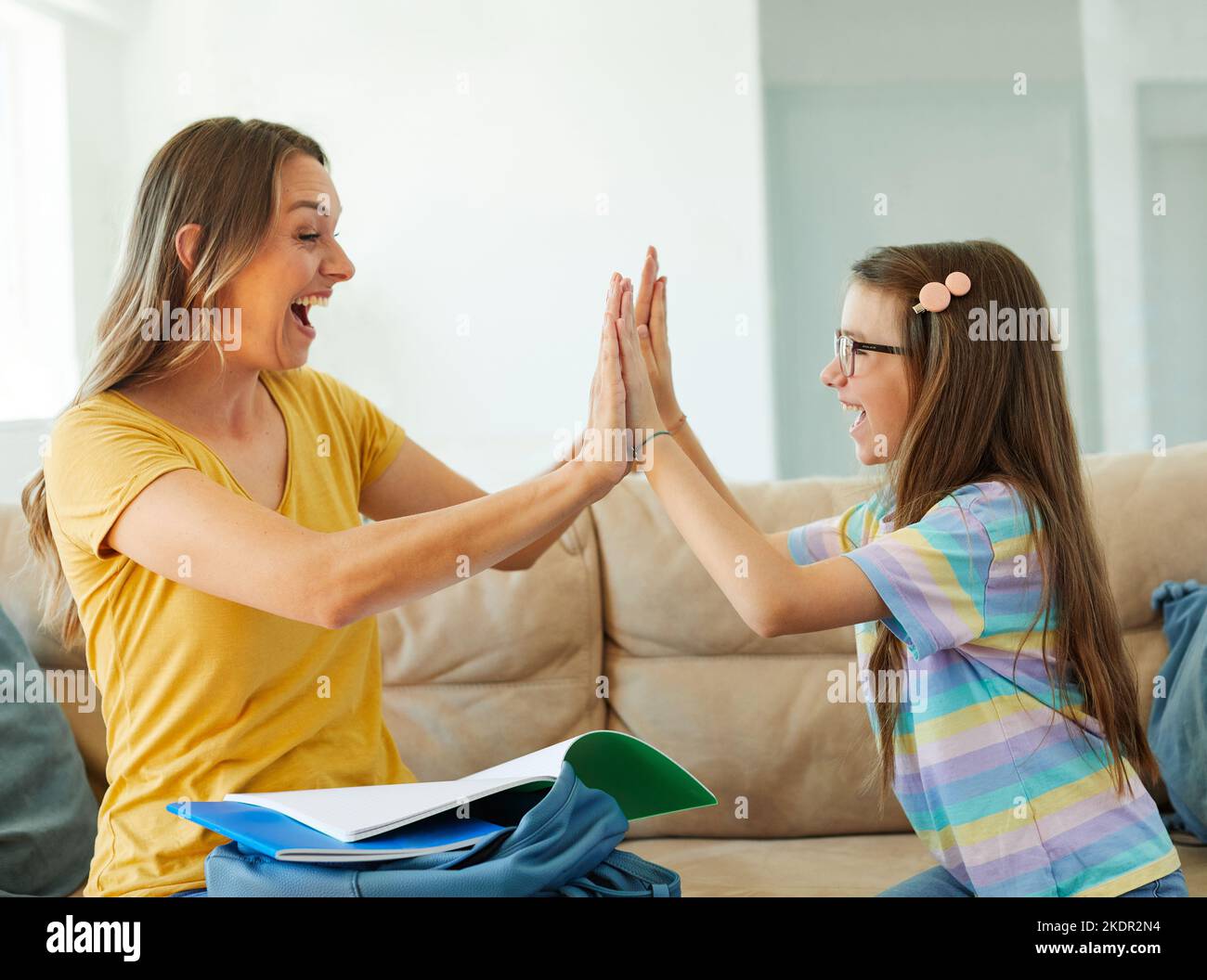 child mother family education school girl home daughter backpack help parent getting ready ...