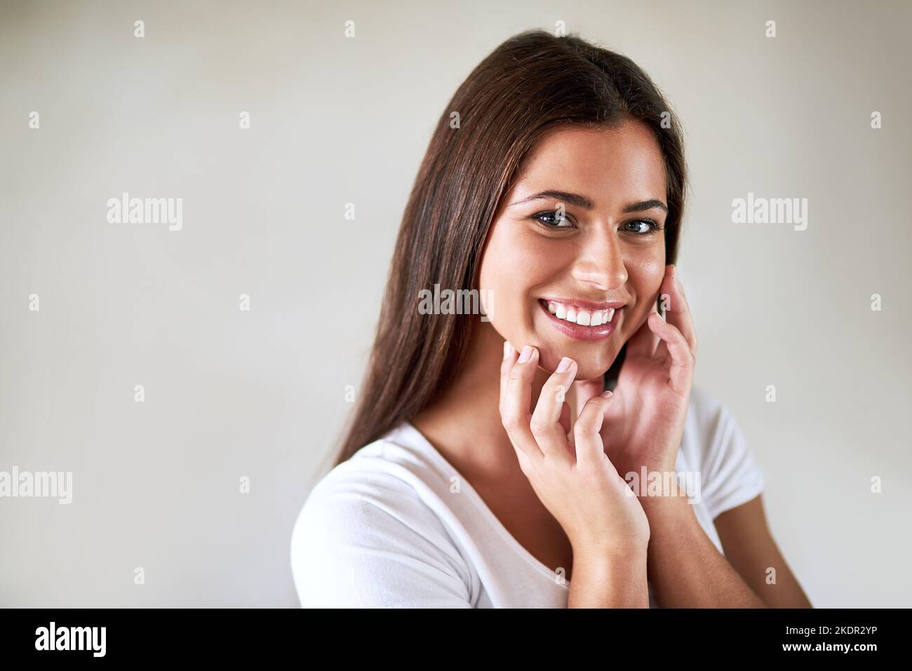 I love my perfect skin. Portrait of a beautiful young woman enjoying ...