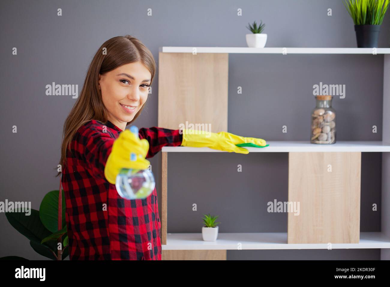 A young female professional cleaner cleans a modern office Stock Photo ...