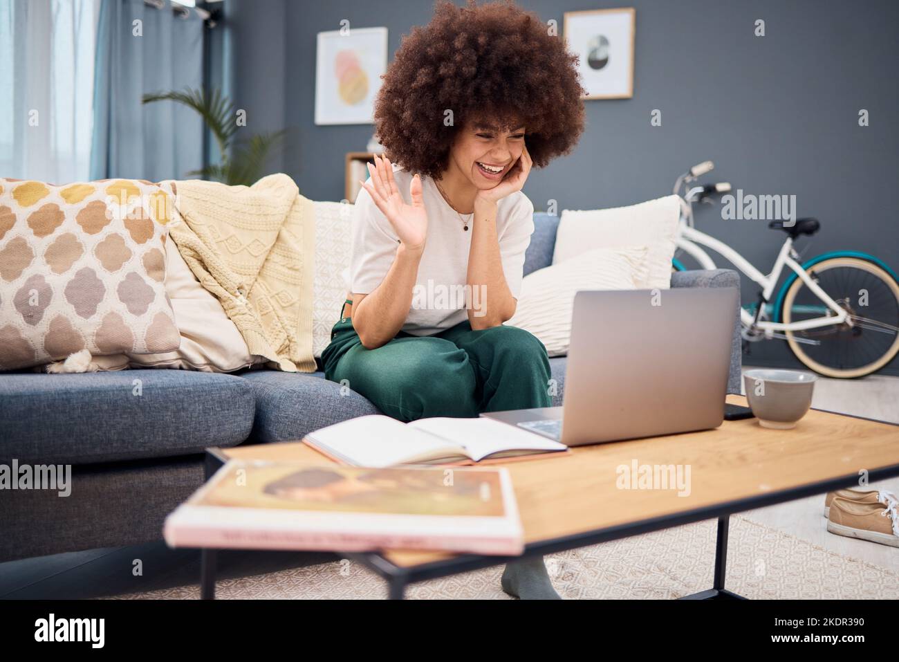 Black woman, waving or video call on remote work laptop in house or ...