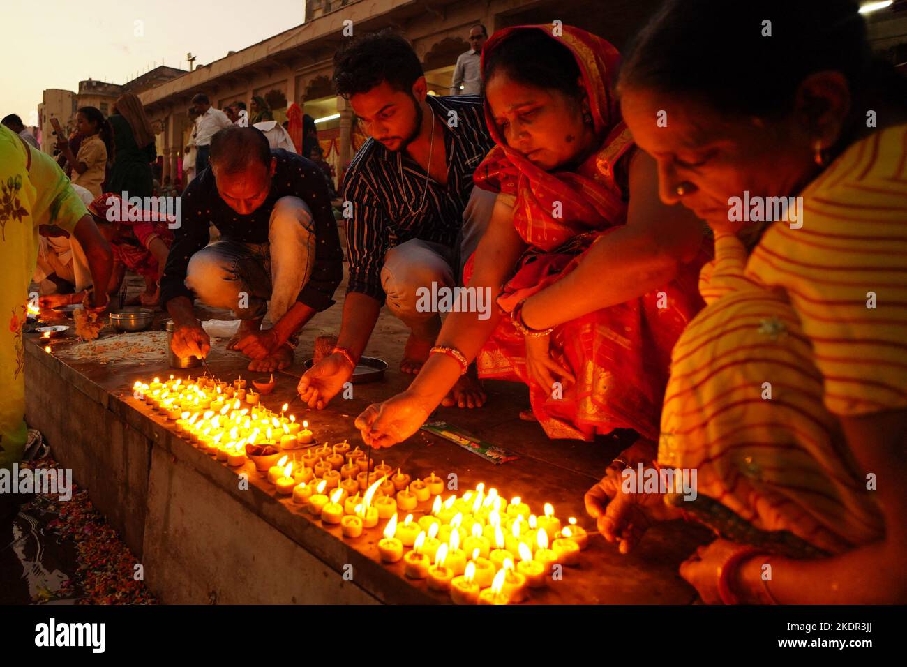 Indian Hindu devotee lights up traditional oil lamps to celebrate Dev ...