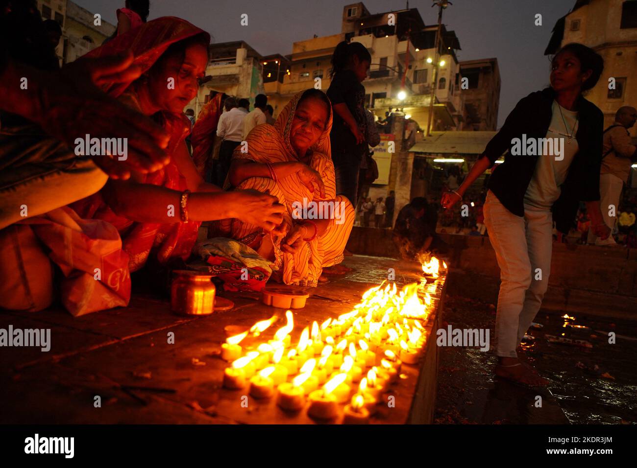 Indian Hindu devotee lights up traditional oil lamps to celebrate Dev ...