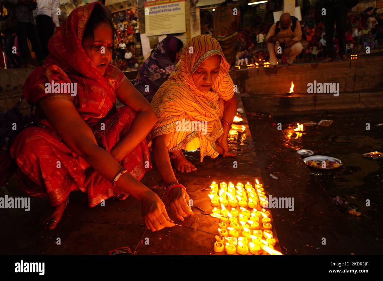 Indian Hindu devotee lights up traditional oil lamps to celebrate Dev ...