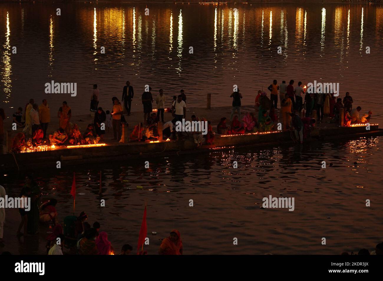 Indian Hindu devotee lights up traditional oil lamps to celebrate Dev ...