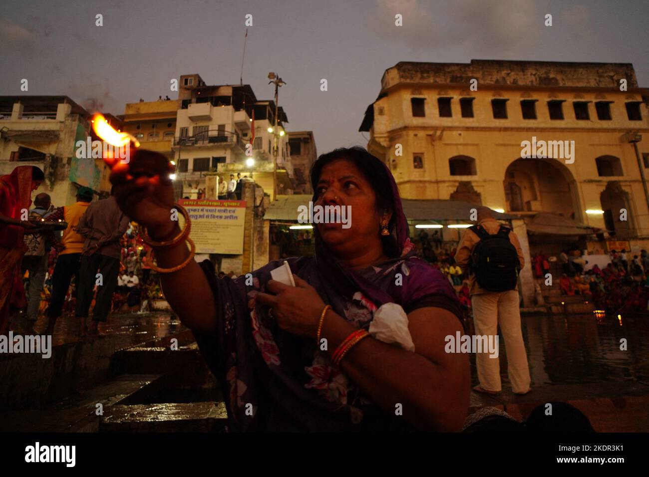 Indian Hindu devotee lights up traditional oil lamps to celebrate Dev ...