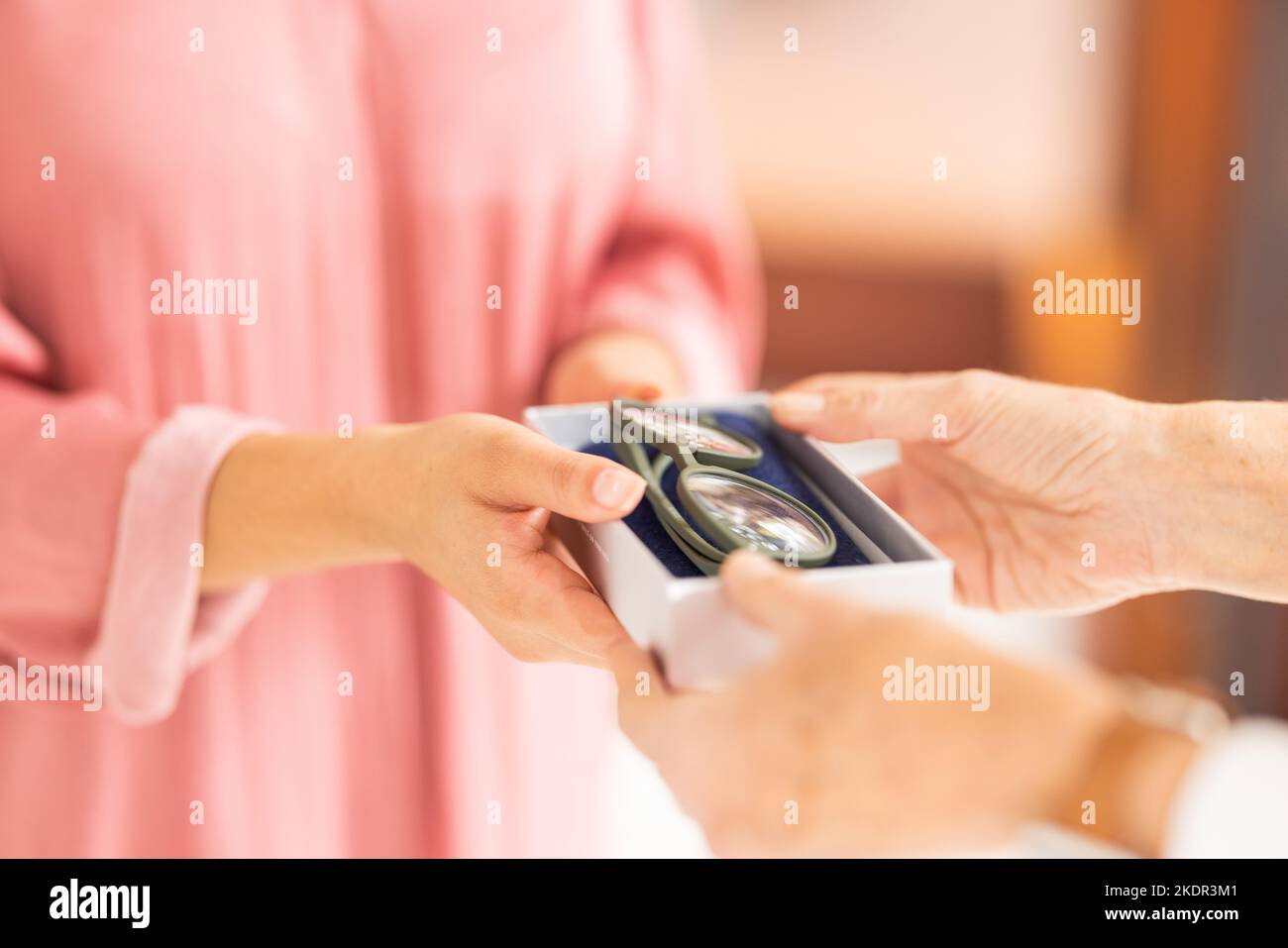 Optometry, eyewear and woman with glasses in a box after shopping in a ...