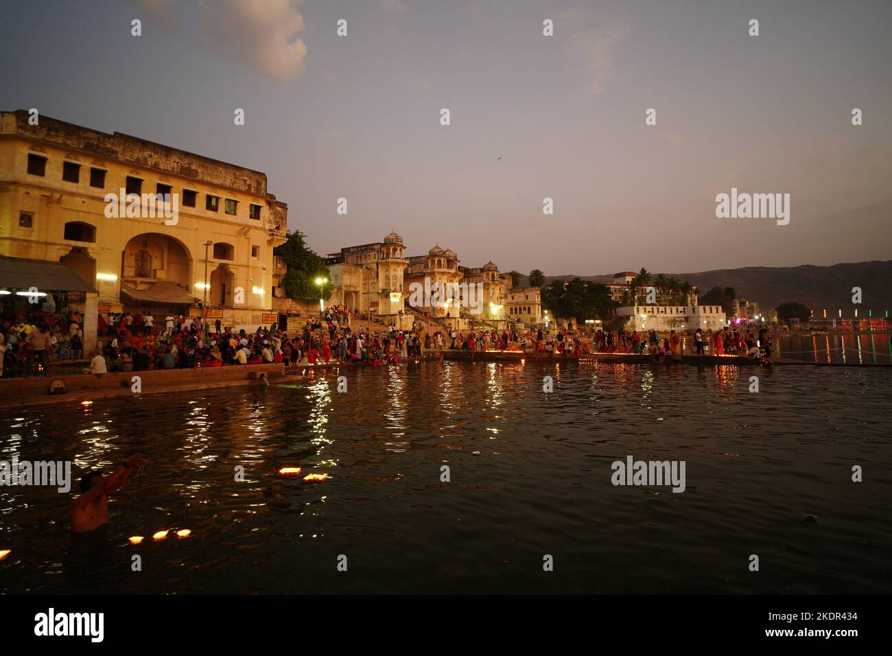 Indian Hindu devotee lights up traditional oil lamps to celebrate Dev ...