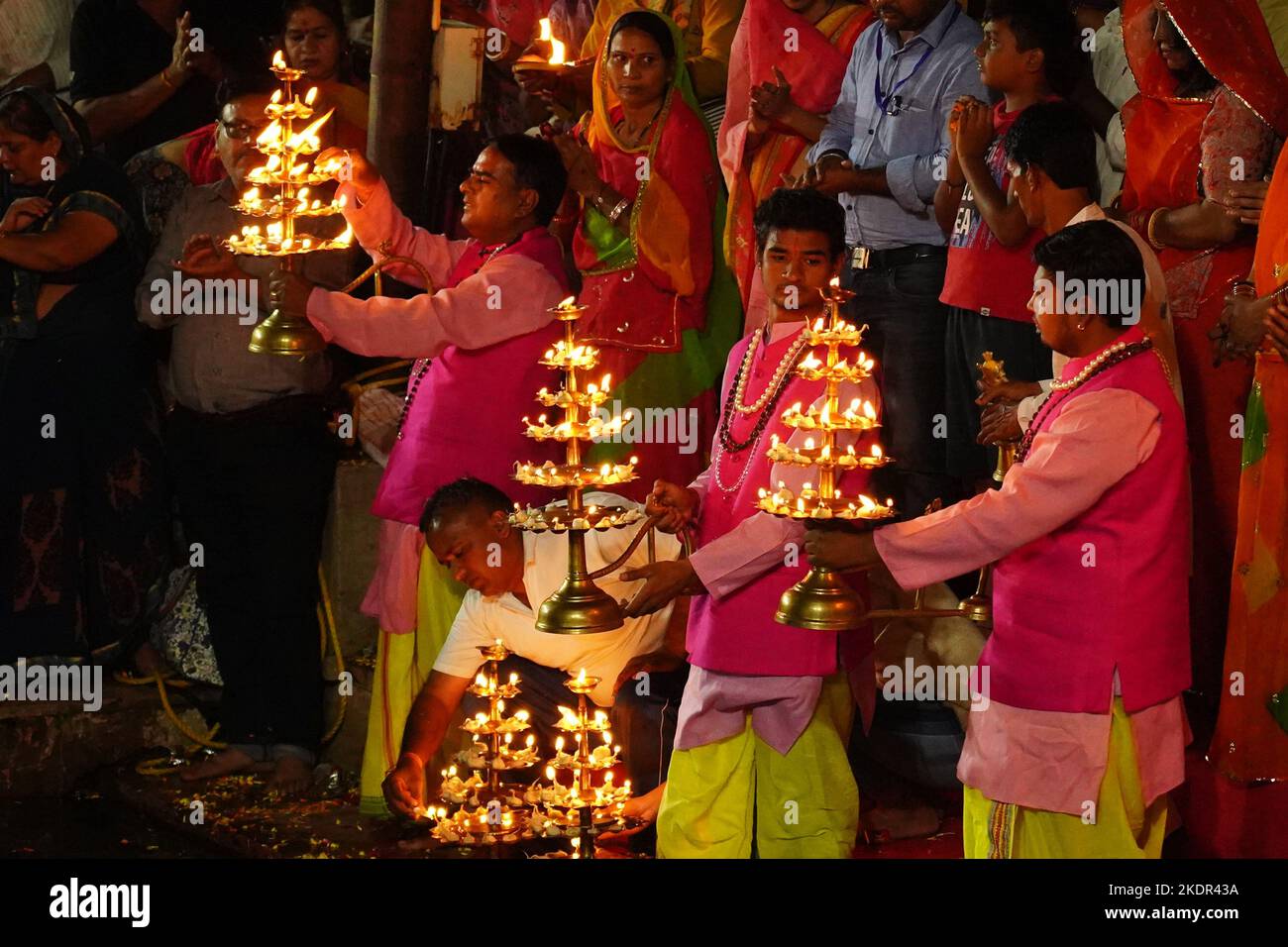 Indian Hindu devotee lights up traditional oil lamps to celebrate Dev ...