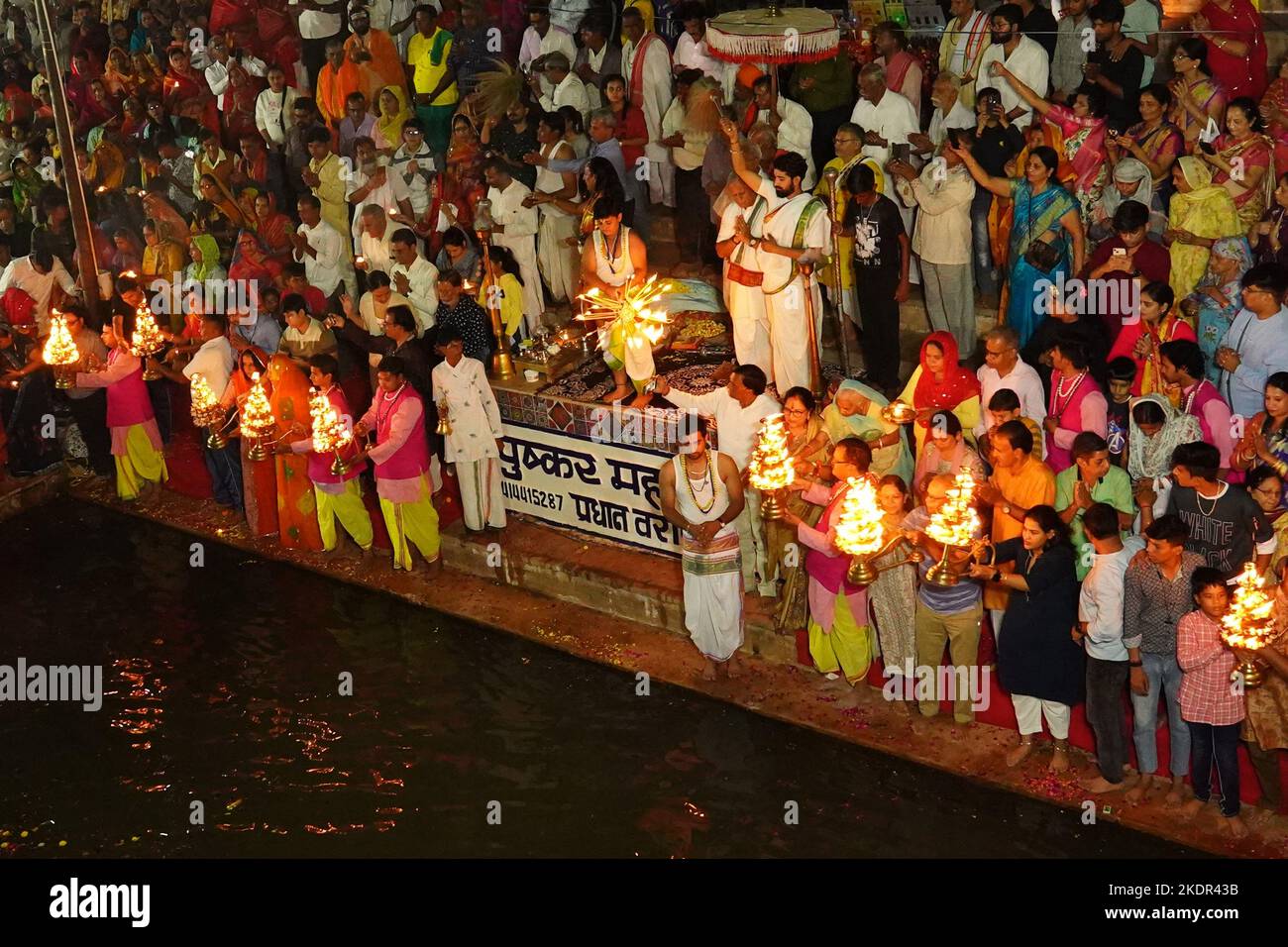 Indian Hindu devotee lights up traditional oil lamps to celebrate Dev ...