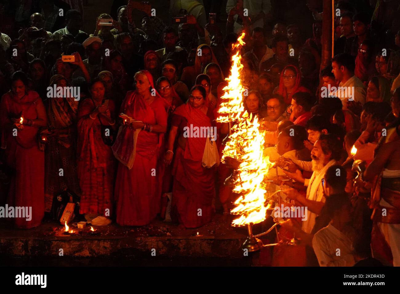 Indian Hindu devotee lights up traditional oil lamps to celebrate Dev ...