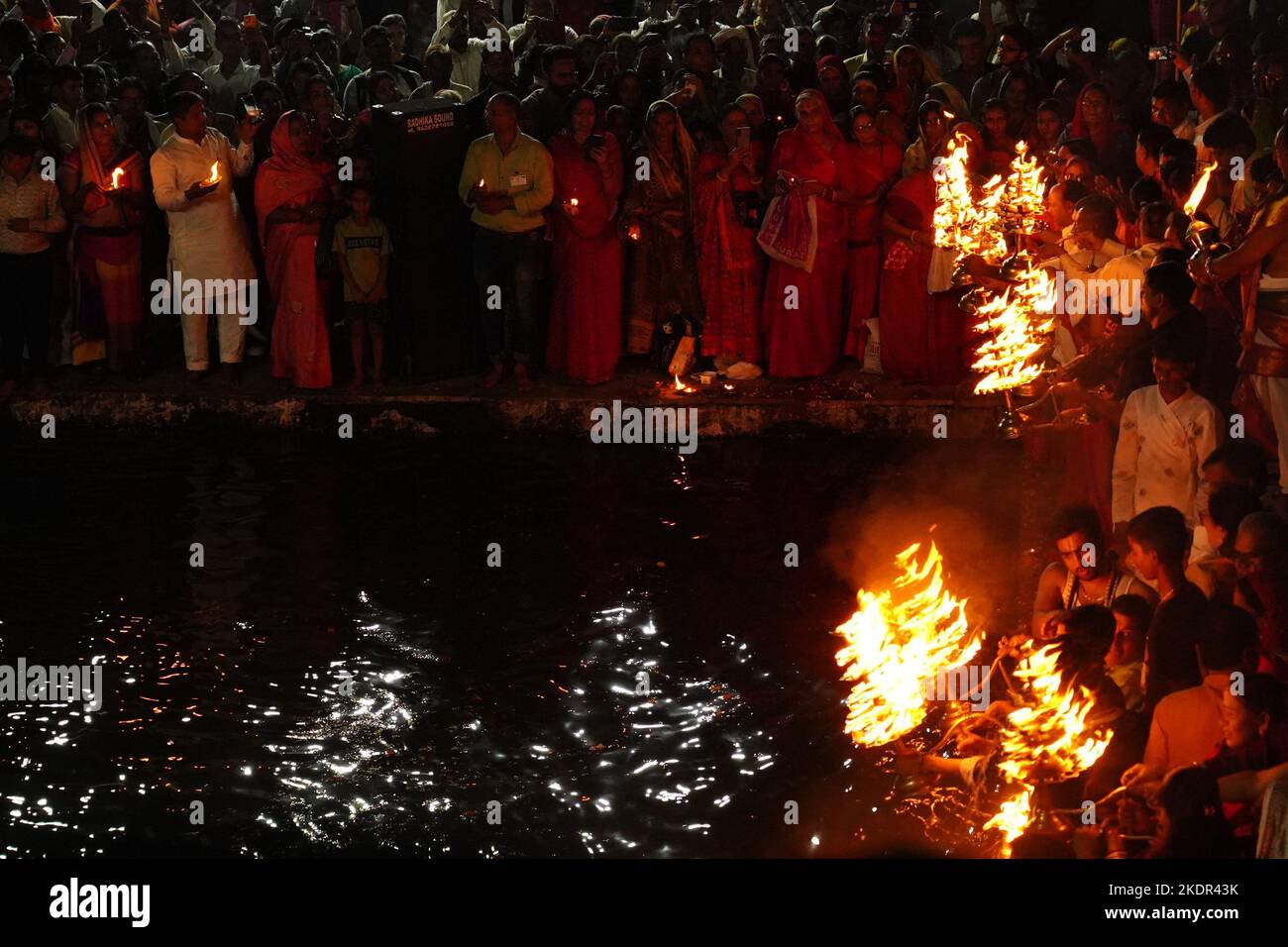 Indian Hindu devotee lights up traditional oil lamps to celebrate Dev ...