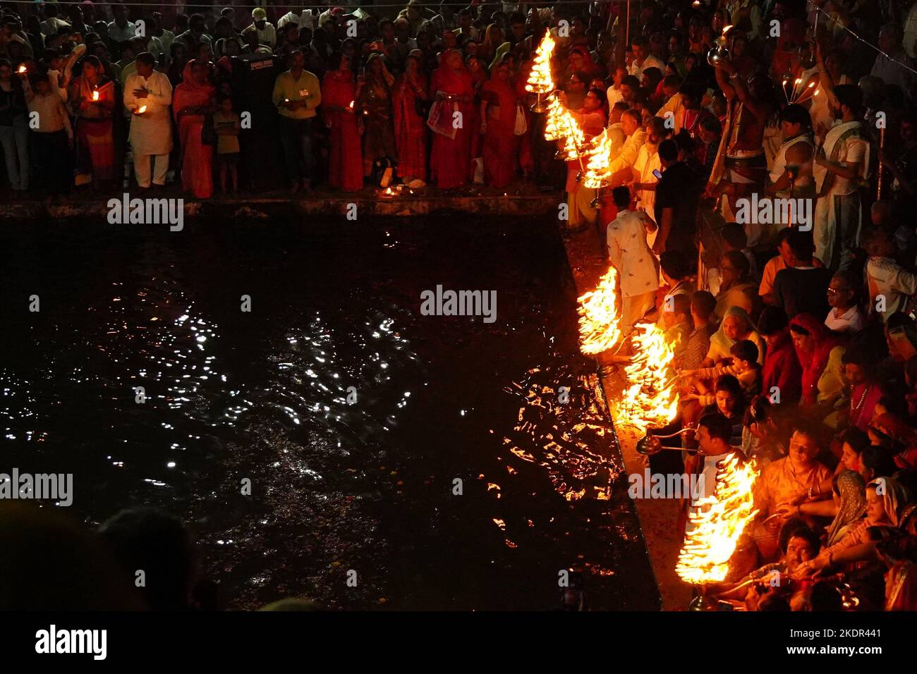 Indian Hindu devotee lights up traditional oil lamps to celebrate Dev ...