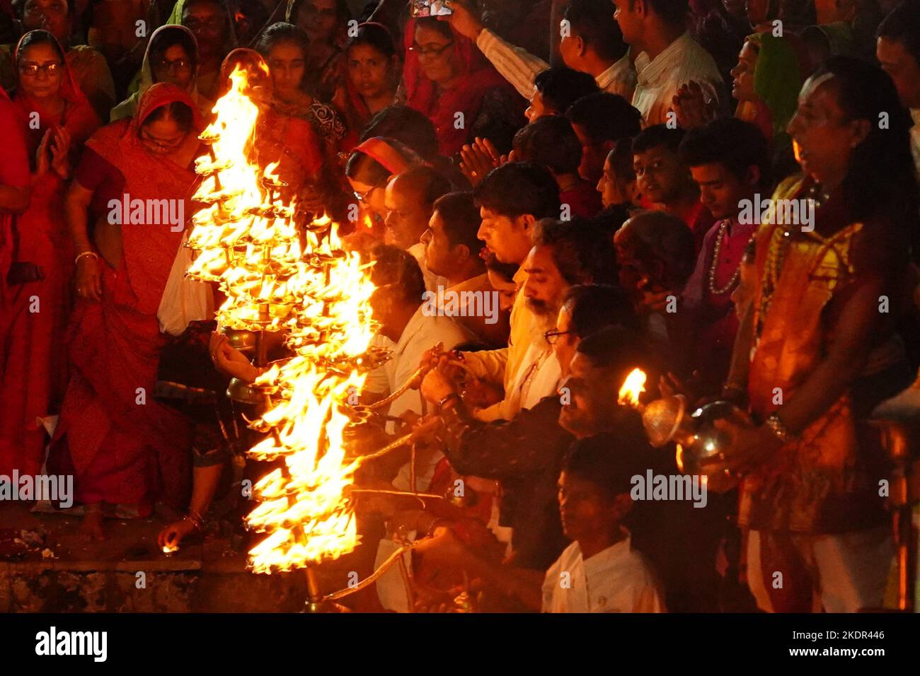 Indian Hindu devotee lights up traditional oil lamps to celebrate Dev ...