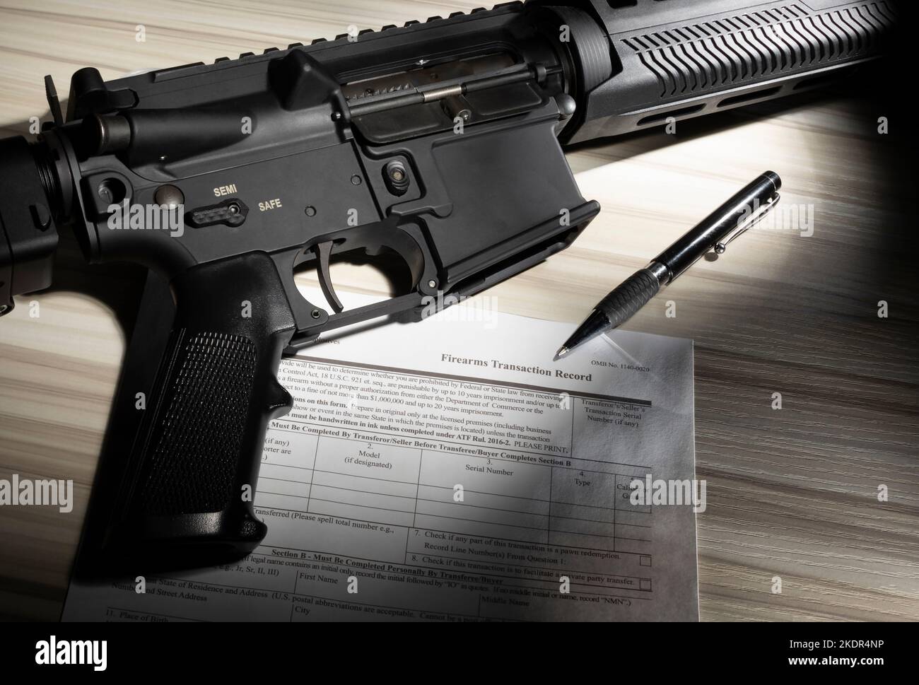 Gun with public domain purchase form and pen Stock Photo - Alamy