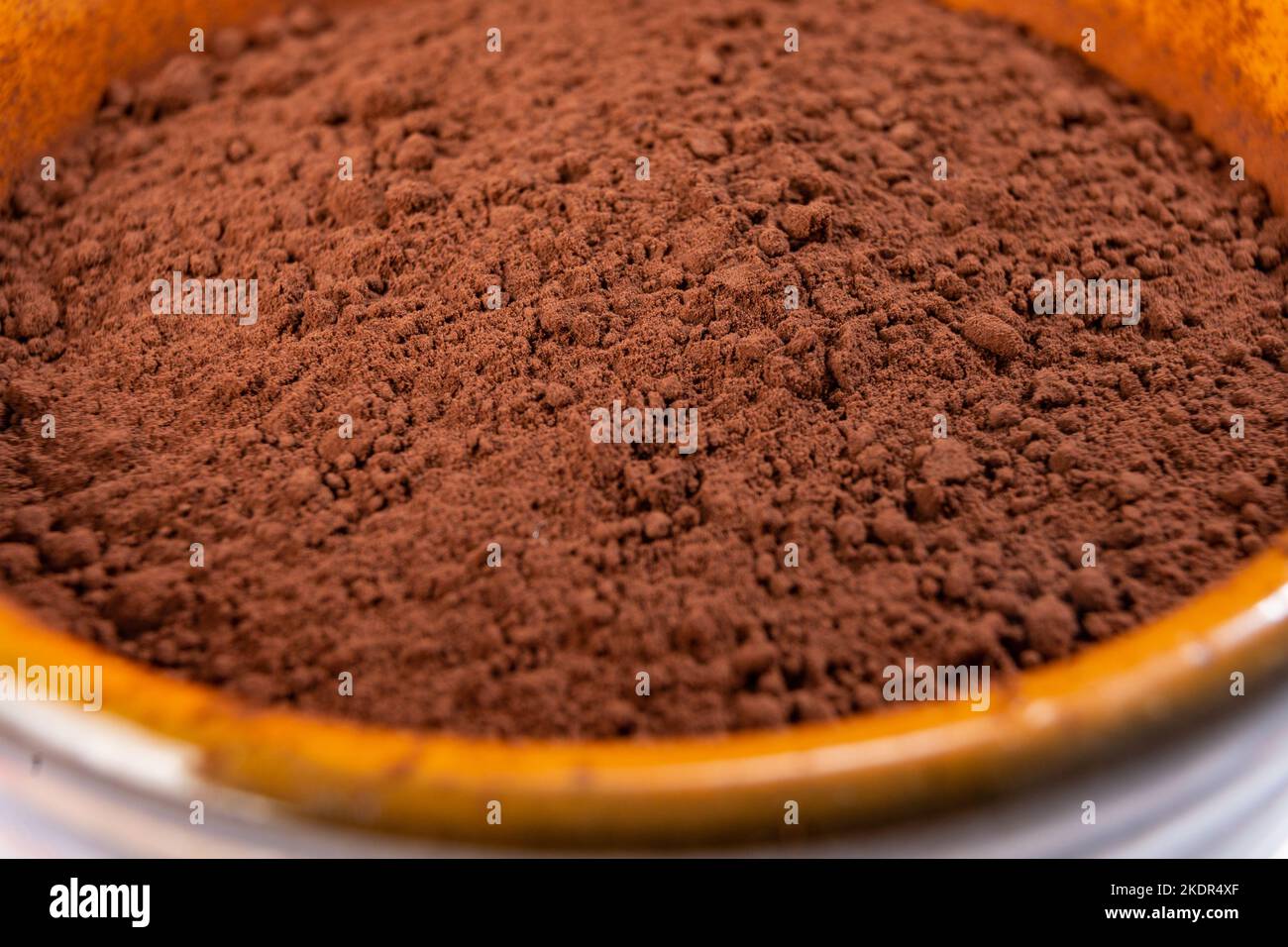 cocoa powder in a bowl shot on a macro lens, powder for making ...