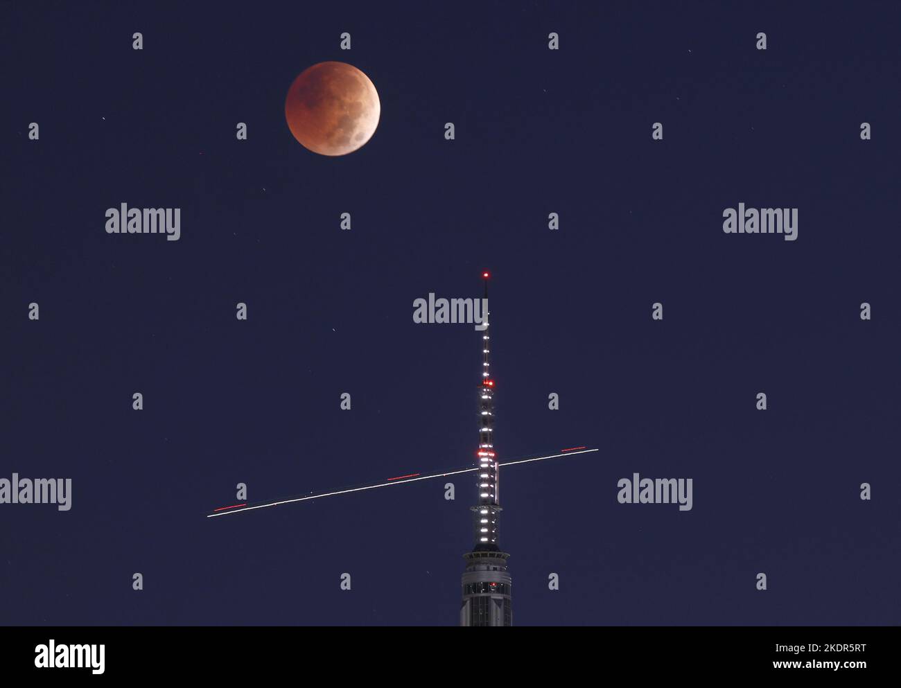 New York, United States. 08th Nov, 2022. A full blood moon sets behind ...