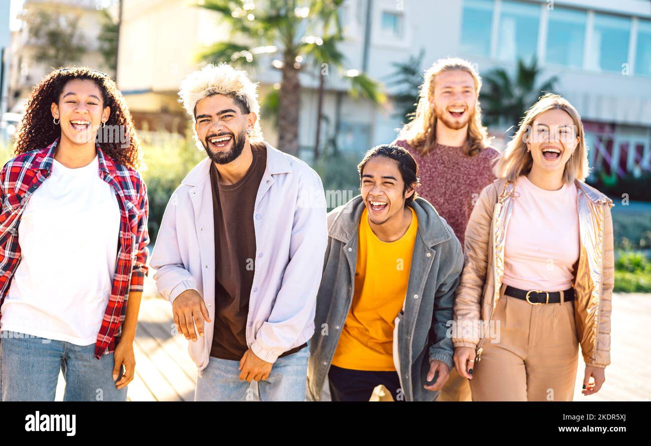 Trendy life style concept with multicultural friends walking together ...