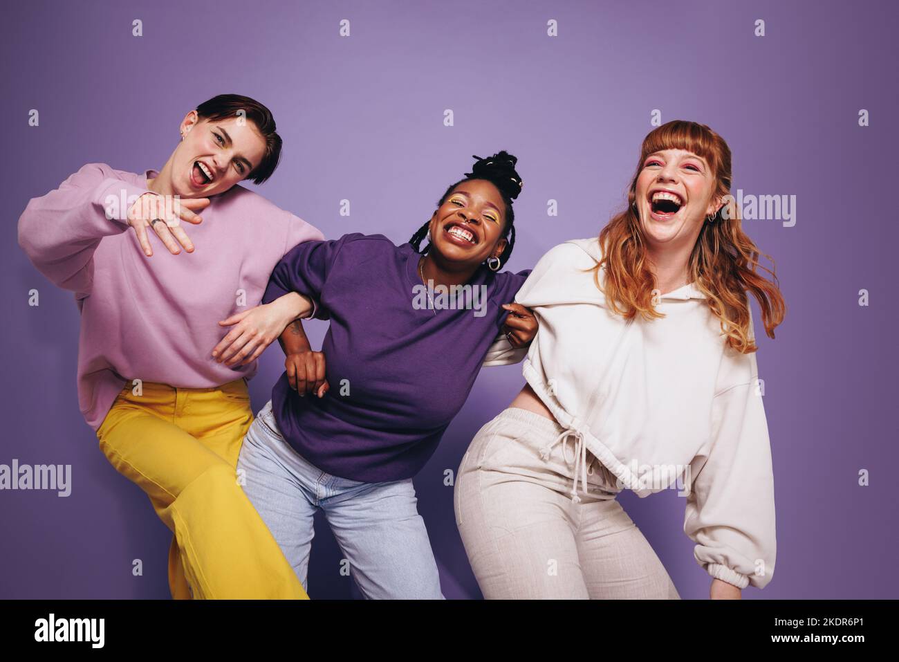 Vibrant multiethnic friends dancing and having fun in a studio. Group ...
