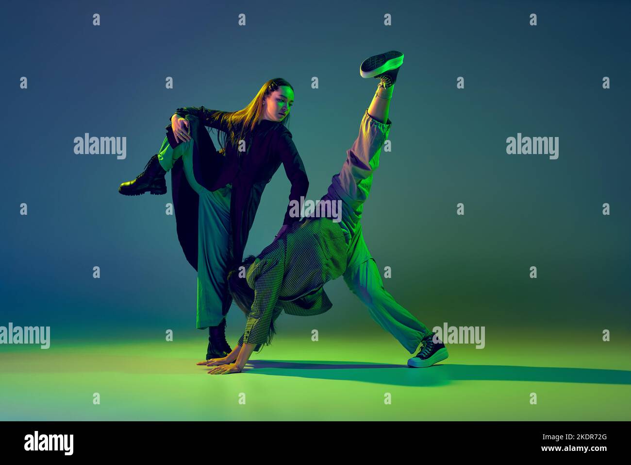 Two dancers, stylish fashionable dance couple dancing contemporary ...