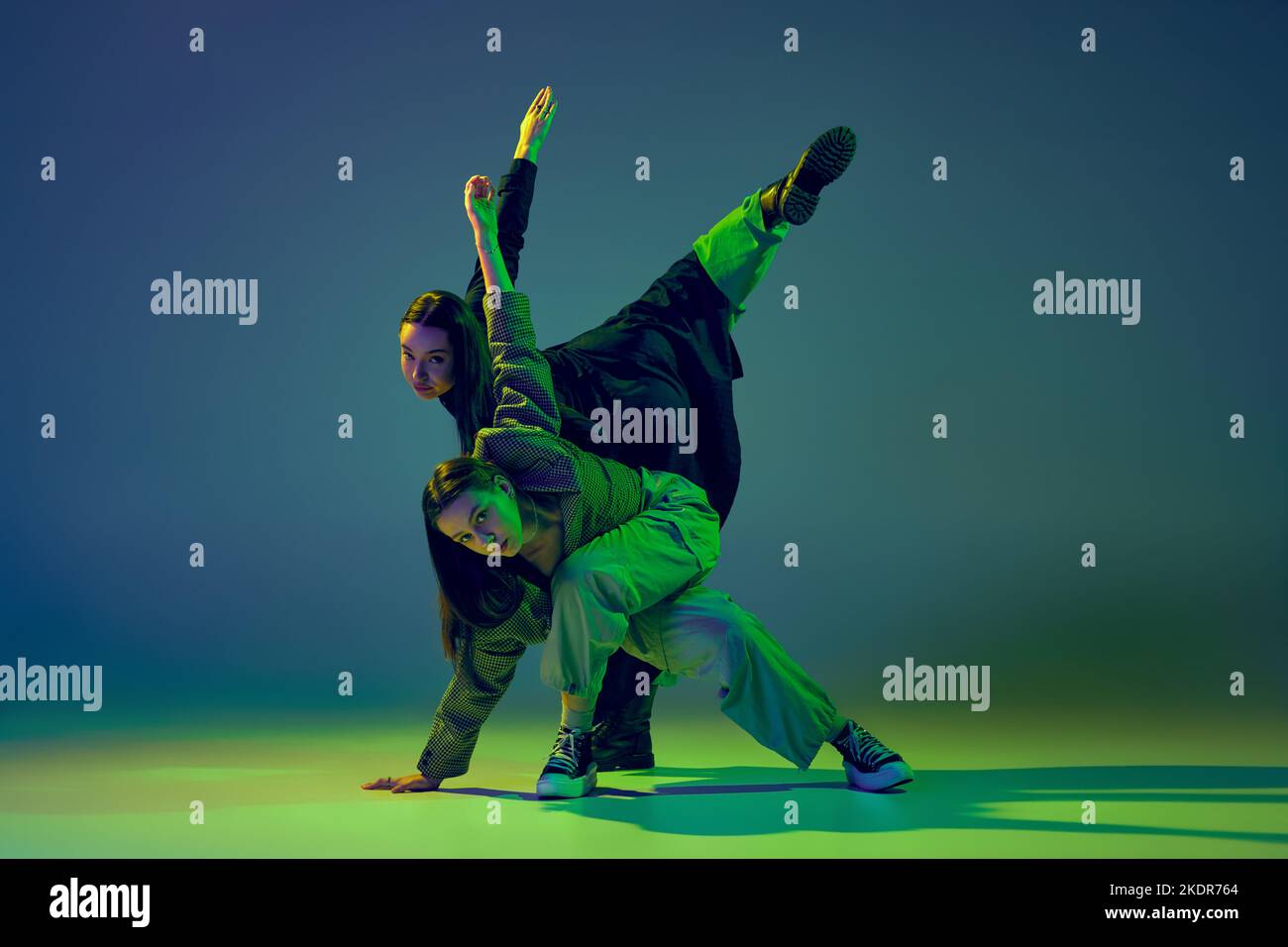 Energy. Stylish young girls dancing casual clothes dancing experimental ...