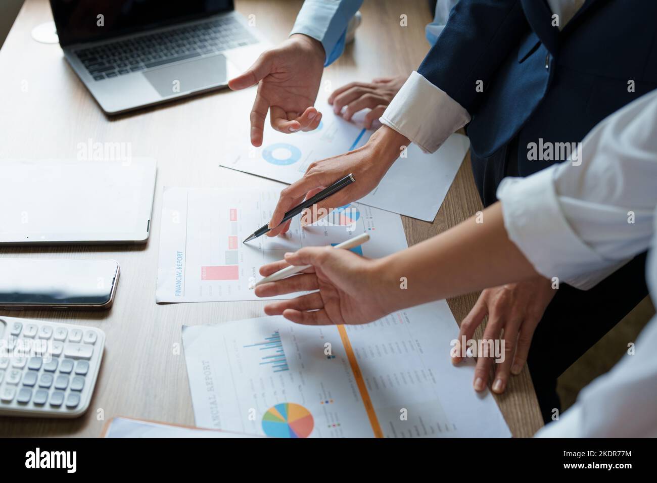 Group business use calculators, documents, computers to analyze work ...