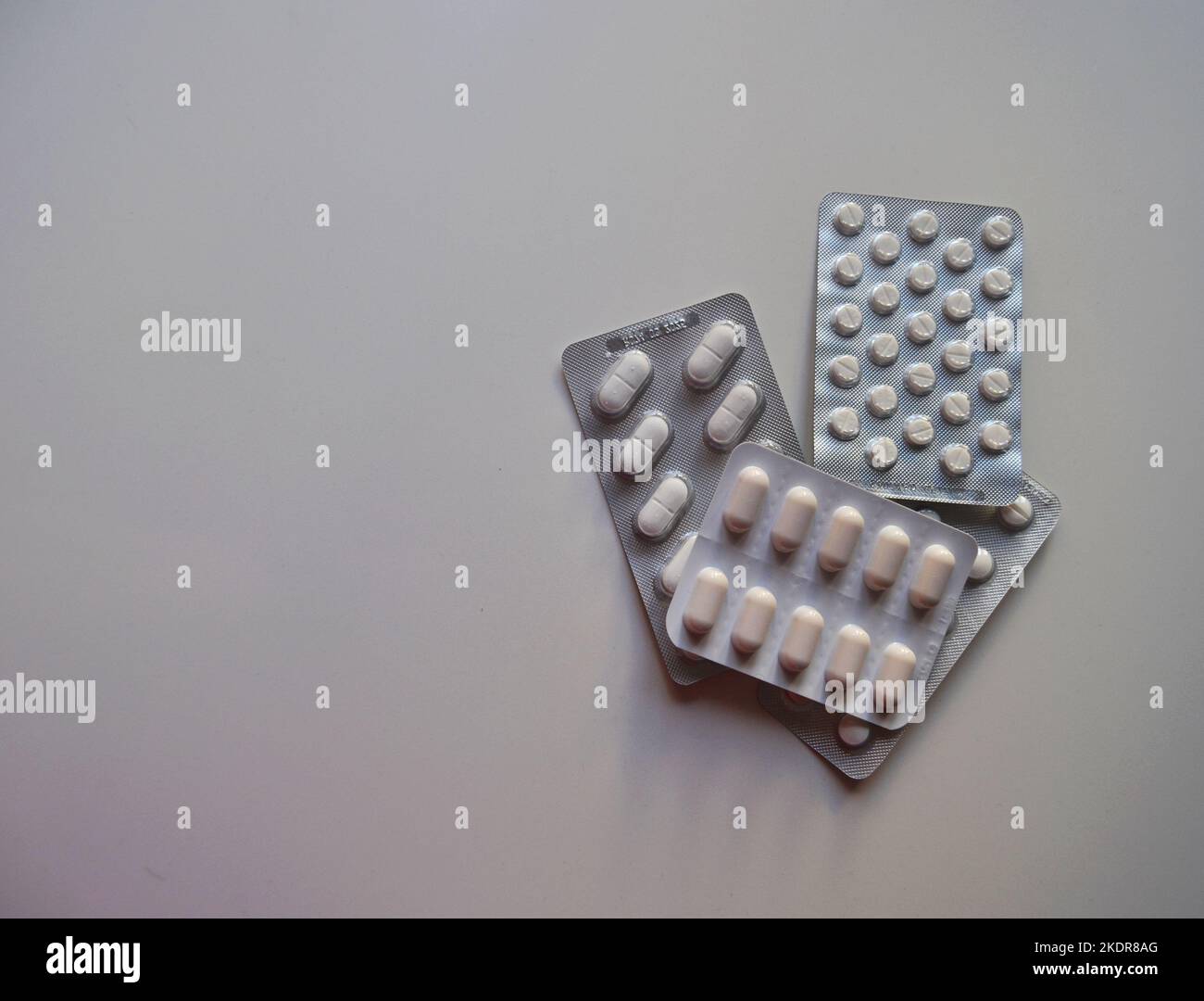 Group of medicine containers in white pills and capsules Stock Photo ...