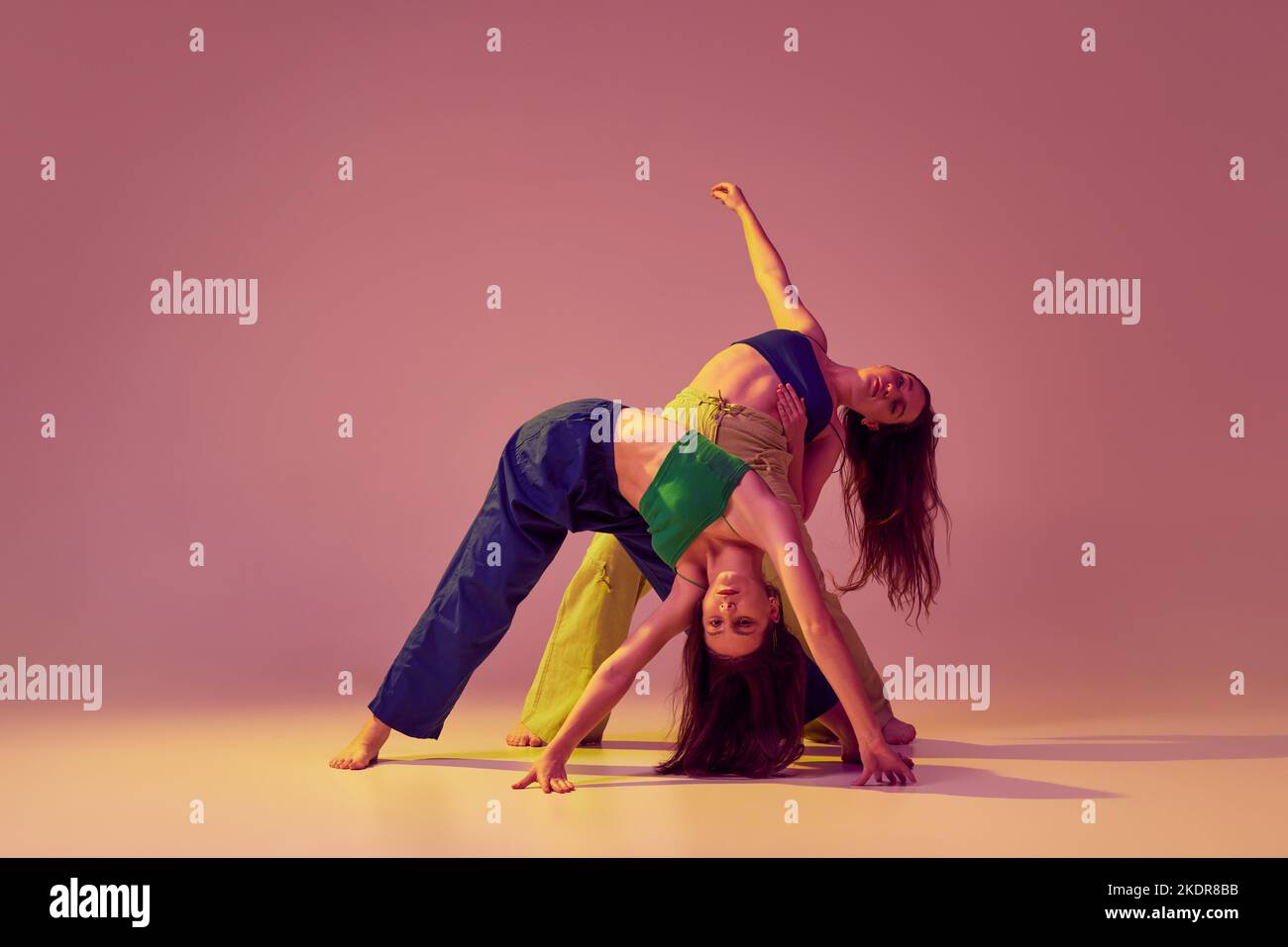 Energetic dancers in art performance at dance hall. Young stylish ...