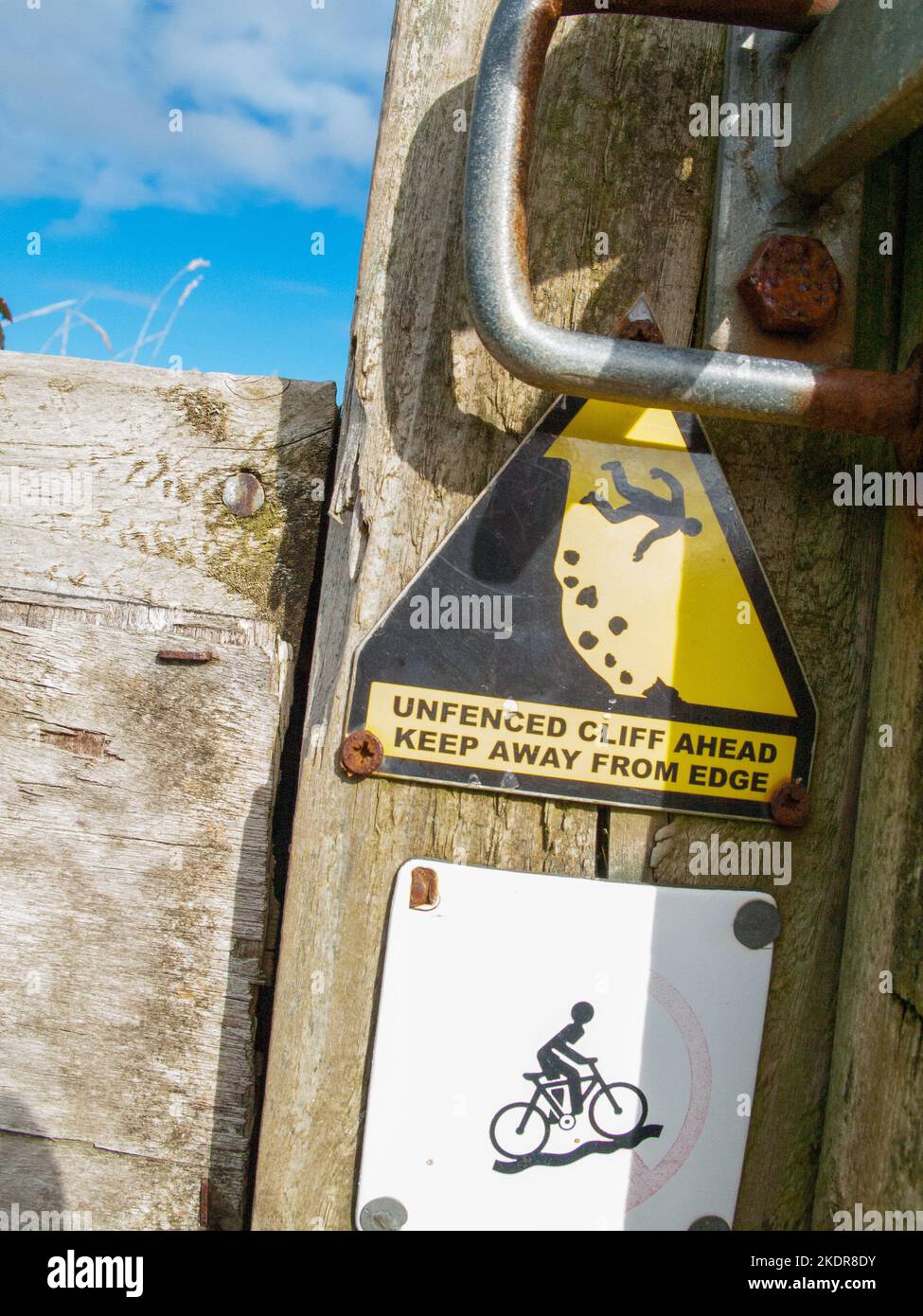 Warning sign for an unfenced cliff on the south west coast path between ...