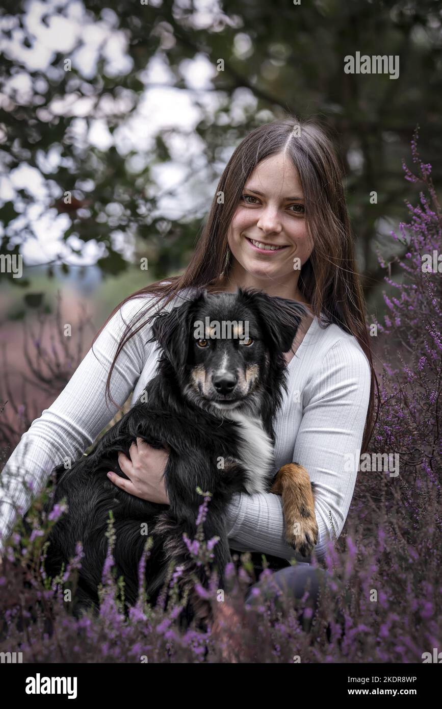 young woman with Miniature Australian Shepherd Stock Photo - Alamy