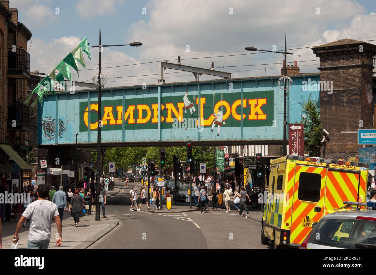 Street view, Camden Lock, London, UK. People, police car, ambulance ...