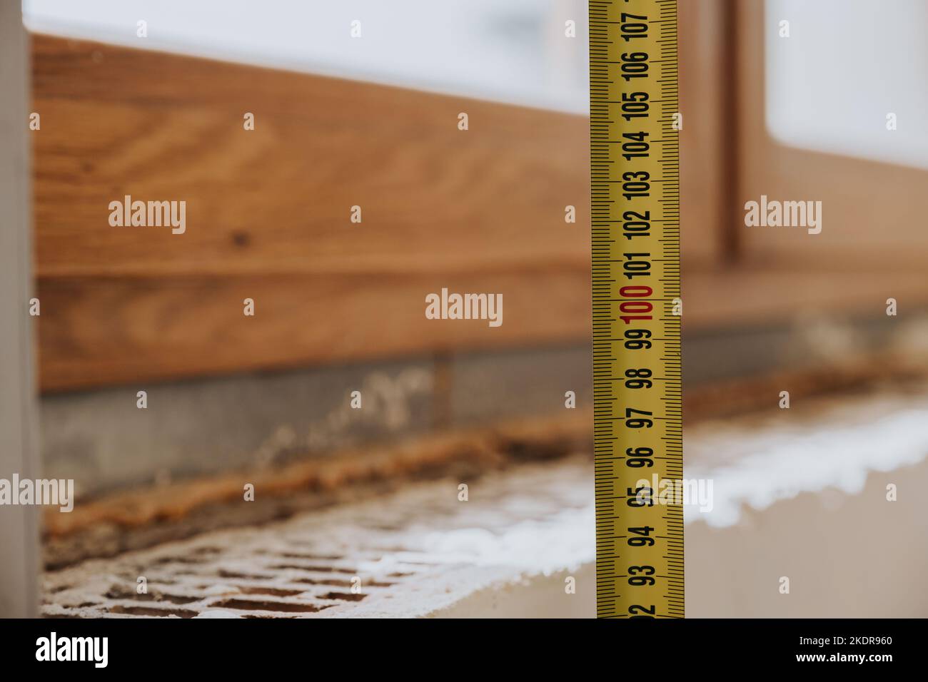 Measuring window for future window sill Stock Photo - Alamy