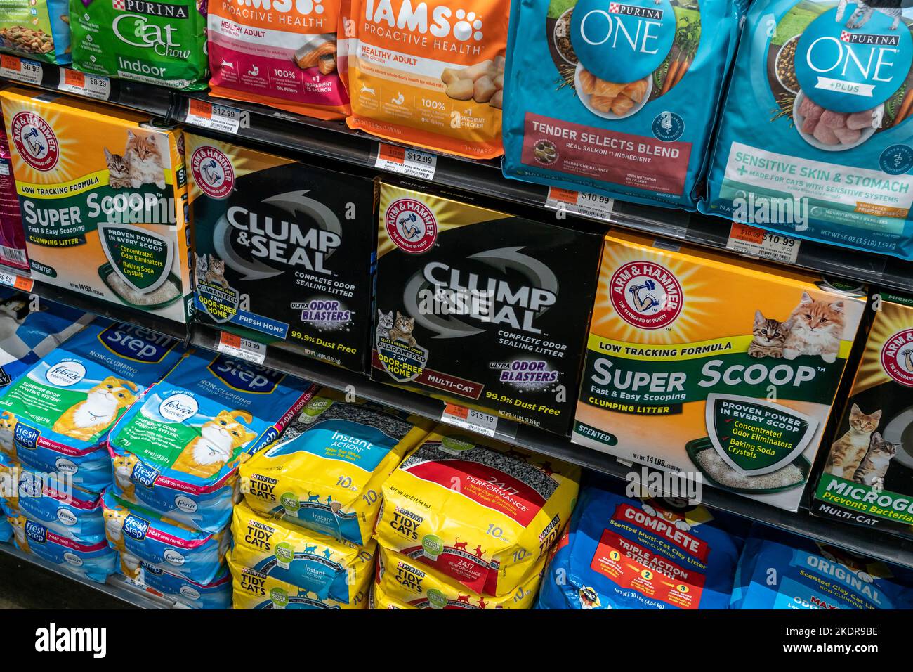 A collection of cat litter and cat food on supermarket shelves in New ...