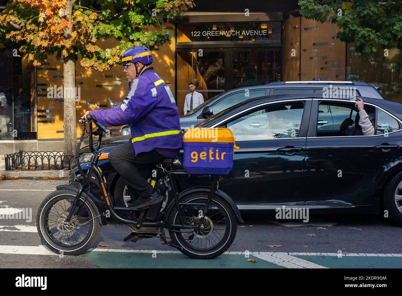 A worker for the superfast grocery delivery service Getir gets on his e ...
