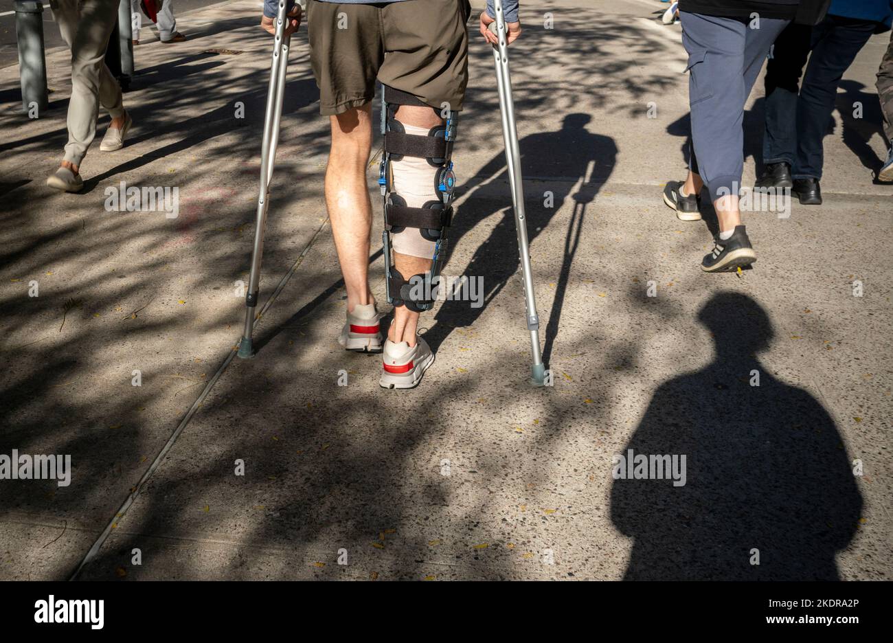 Man on crutches with leg brace in New York on Thursday, November 3 ...