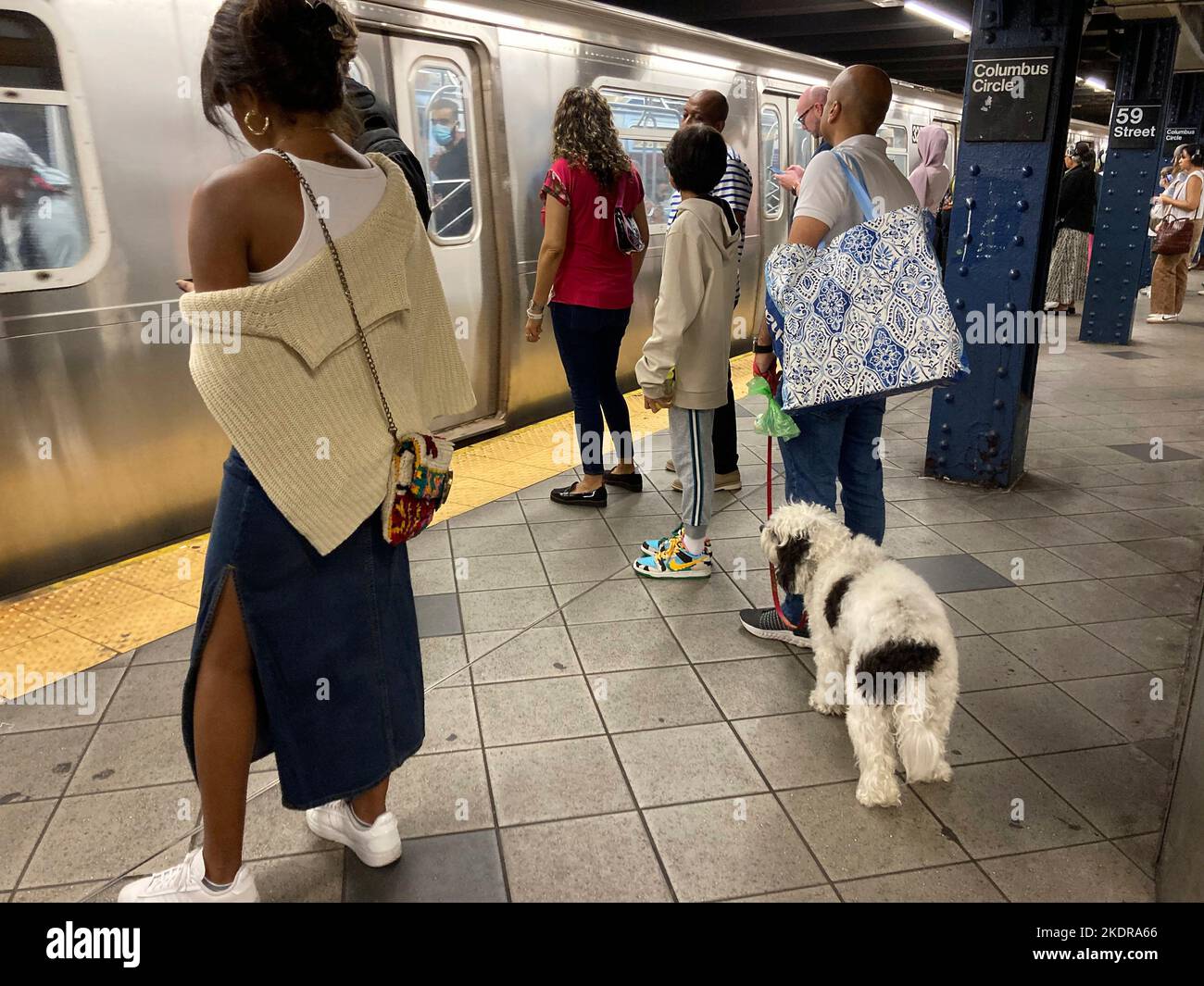 Weekend subway ridership in New York, riders wait at the Columbus ...