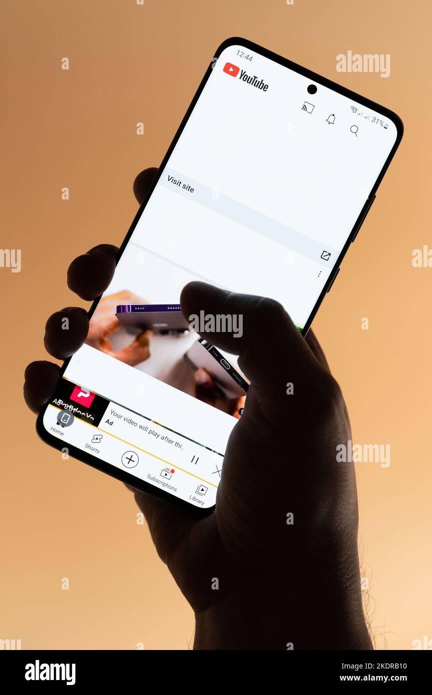 New york, USA - November 4, 2022: Using youtube app on smartphone ...