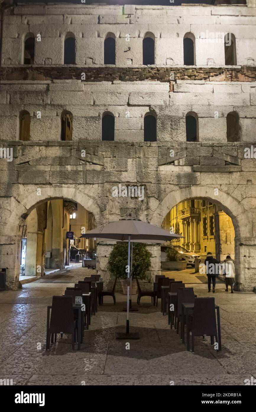 The beautiful Borsari Gate in Verona illuminated at night Stock Photo ...