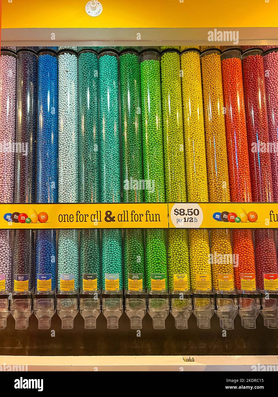 Plastic pipes with colored M&MS candies Stock Photo - Alamy