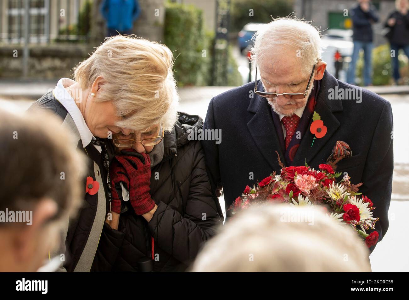 Injured victim Jim Dixon (right) stands as his daughter Sharon Breen ...