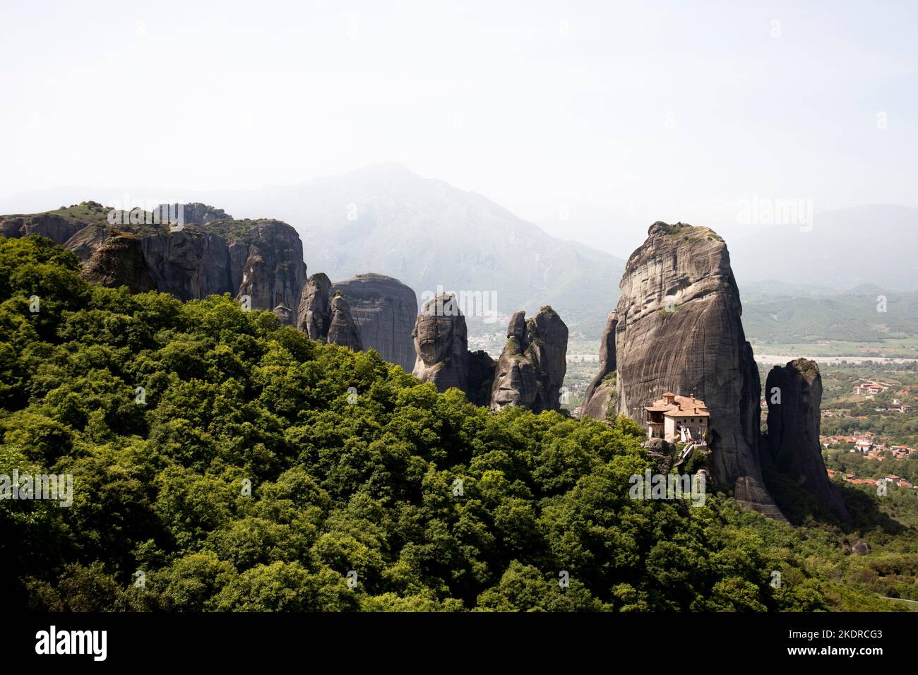 Rocky landscape in metera with the forest and a monastery Stock Photo ...