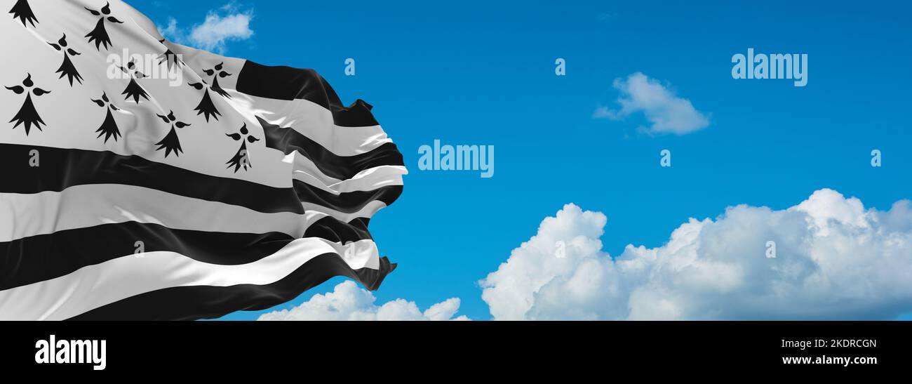 flag of Celtic peoples Bretons at cloudy sky background, panoramic view ...