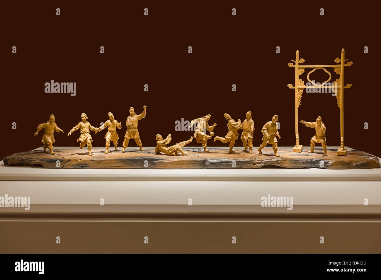 Chinese craft art gallery - sculpture carved - cuju Stock Photo - Alamy