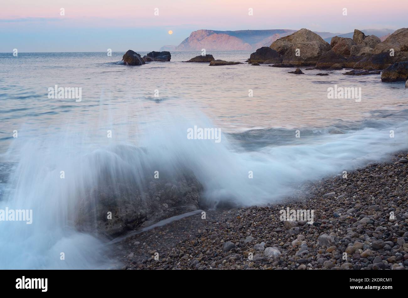 Morning landscape with the moon. Sea waves splashing Stock Photo - Alamy