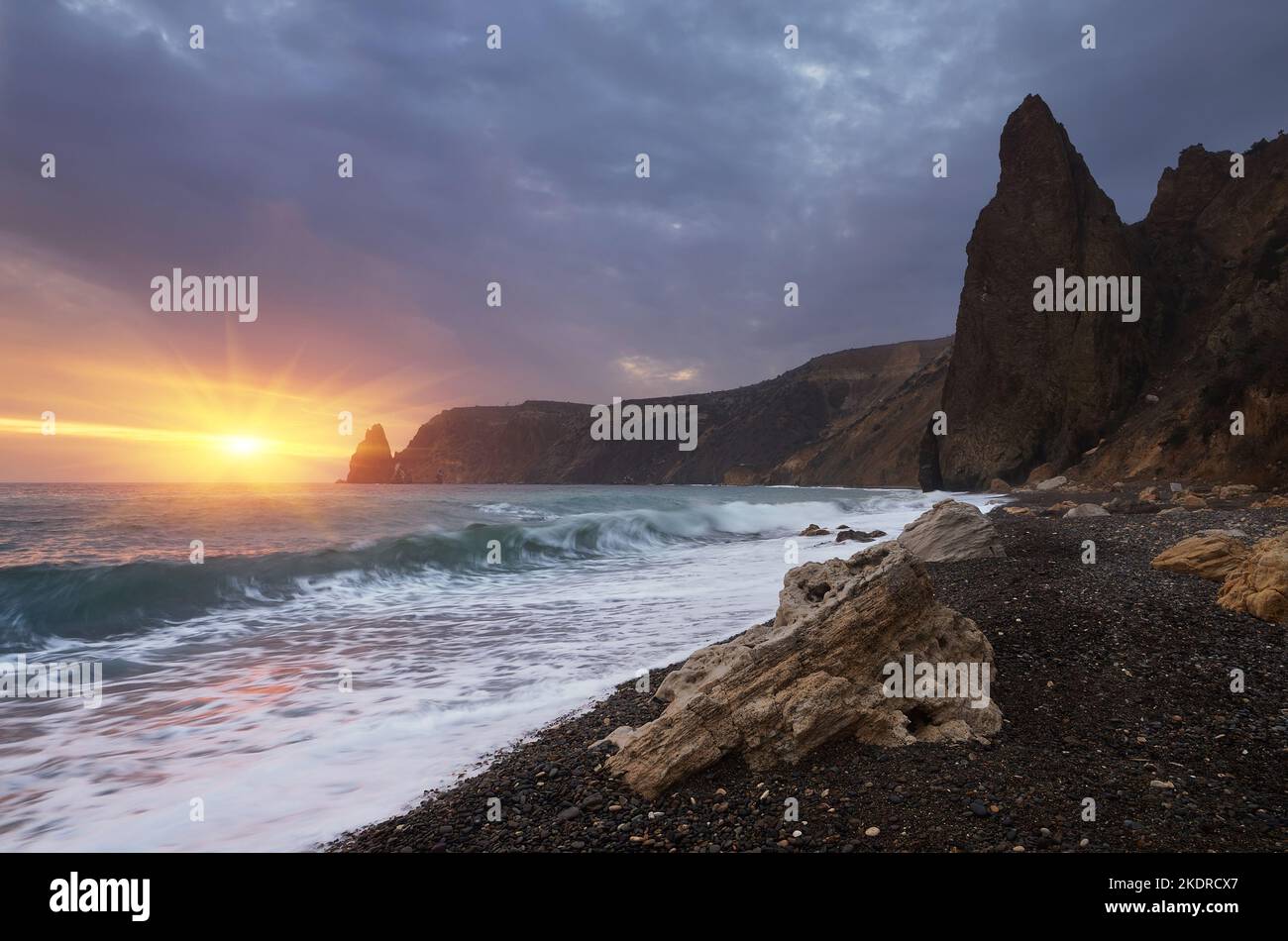 Seascape with coastal cliffs. Wonderful evening with a beautiful sunset ...